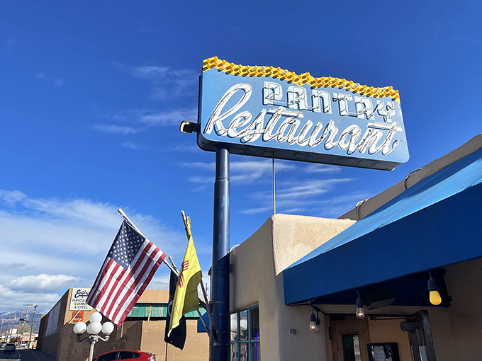 That iconic blue awning against adobe walls isn't just a sign&mdash;it's a beacon of breakfast hope for hungry Santa Feans who know the early bird gets the huevos.