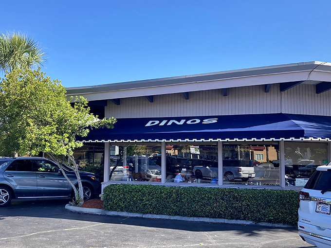 The unassuming blue awning of Dino's beckons like a breakfast lighthouse, guiding hungry souls through the morning fog of indecision.