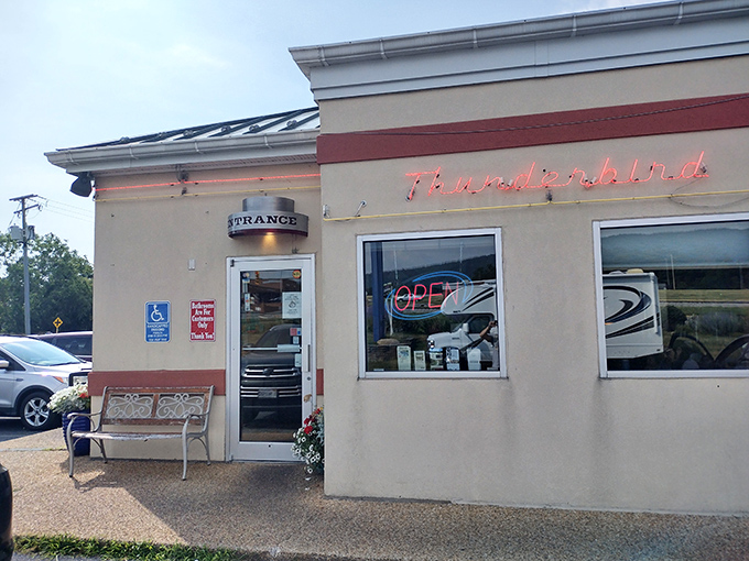 The unassuming exterior of Thunderbird Cafe stands like a beacon of breakfast hope, its neon sign promising delicious revelations within.