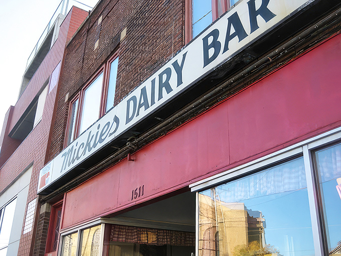 The iconic Mickies Dairy Bar sign stands proudly against Madison's skyline, a beacon of breakfast hope for hungry Badger fans and locals alike.