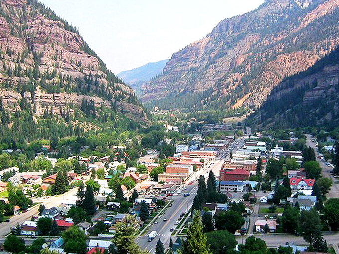 Ouray nestles perfectly in its mountain cradle like nature's version of a snow globe village &ndash; minus the artificial snow and plastic dome.