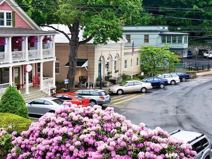Charming cedar-shingled architecture gives Chester its storybook appeal. This cottage-style shop epitomizes New England charm with seasonal planters adding vibrant color.