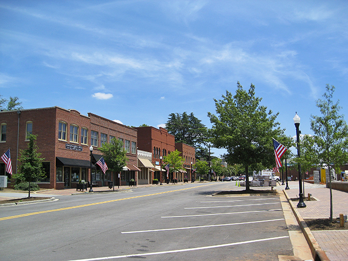 Downtown Madison's brick storefronts stand at attention like well-dressed Southern gentlemen, American flags fluttering in the Georgia breeze.
