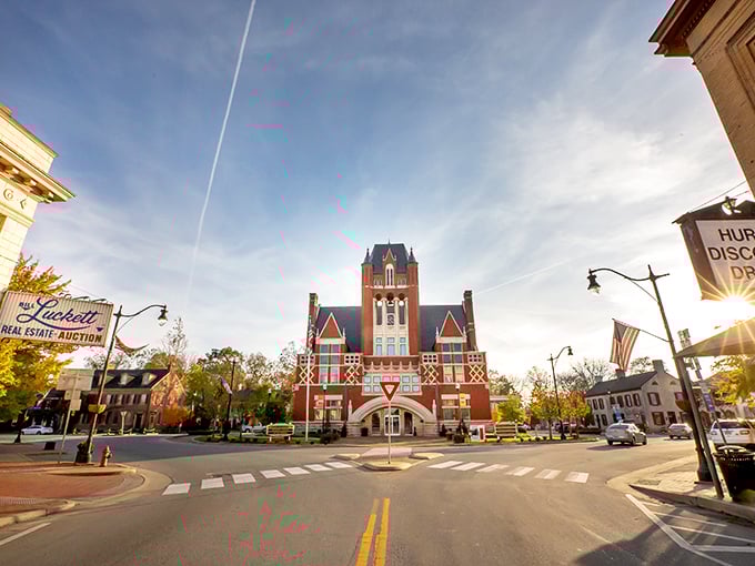 Bardstown's courthouse stands like a Victorian sentinel watching over the town square, its brick fa&ccedil;ade glowing warm in the golden hour light.