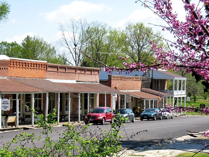 Arrow Rock unfolds like a living watercolor painting, its autumn-tinged trees and historic rooftops creating a scene worthy of a PBS special.