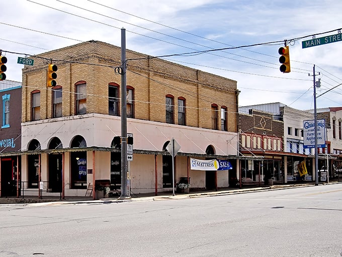 Downtown Llano stretches before you like a classic Texas postcard—historic storefronts, pickup trucks, and that big sky promising adventure around every corner.