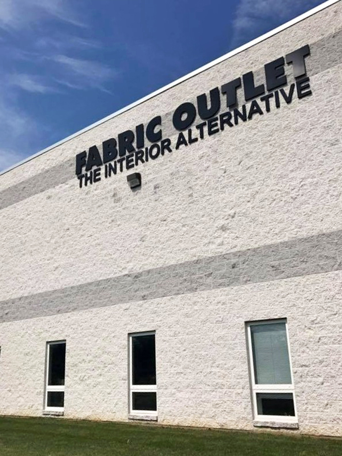 The unassuming exterior of fabric paradise &ndash; where textile dreams come true behind plain white walls. Who knew heaven had industrial siding?