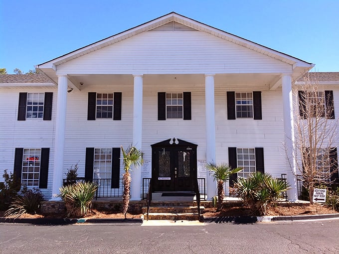 Southern charm meets textile heaven in this stately white mansion. Who knew fabric shopping could come with columns and palm trees?