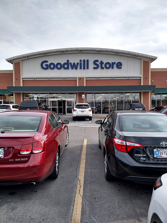 The Goodwill Store in Fishers stands like a fortress of forgotten treasures, its blue sign beckoning bargain hunters and nostalgia seekers alike.