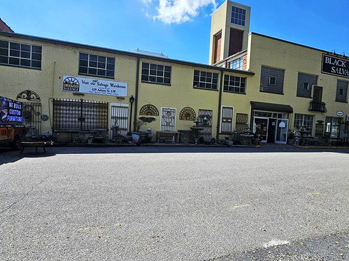 The sunshine-yellow exterior of Black Dog Salvage stands like a beacon for treasure hunters. This architectural playground in Roanoke promises adventures in every corner.