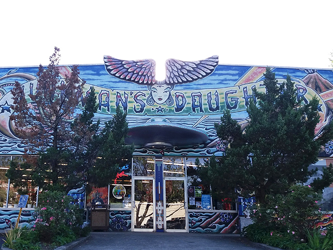 The psychedelic facade of Junkman's Daughter looks like what would happen if Salvador Dal&iacute; designed a retail store. Wings, hands, and cosmic imagery announce: normal stuff definitely not sold here.
