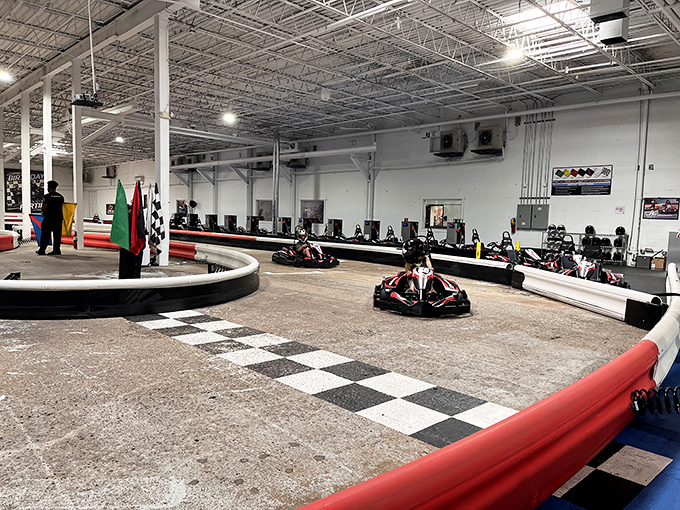 The checkered flag awaits as electric karts zoom around K1 Speed's professionally designed indoor track. Racing dreams come true regardless of weather outside.