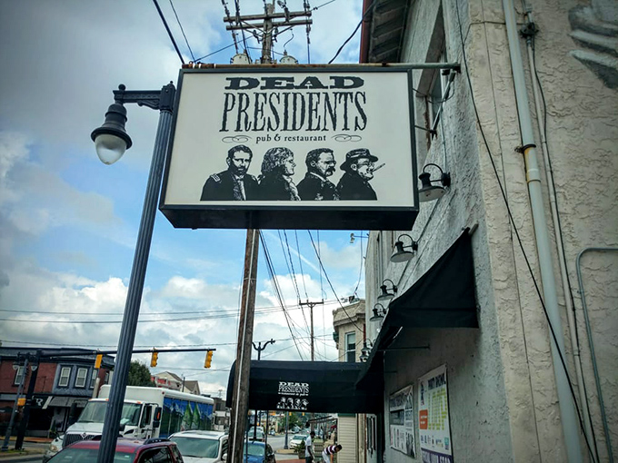 The iconic Dead Presidents sign welcomes patrons with silhouettes of Lincoln, Jefferson, Roosevelt, and Washington &ndash; history class never looked this appetizing.