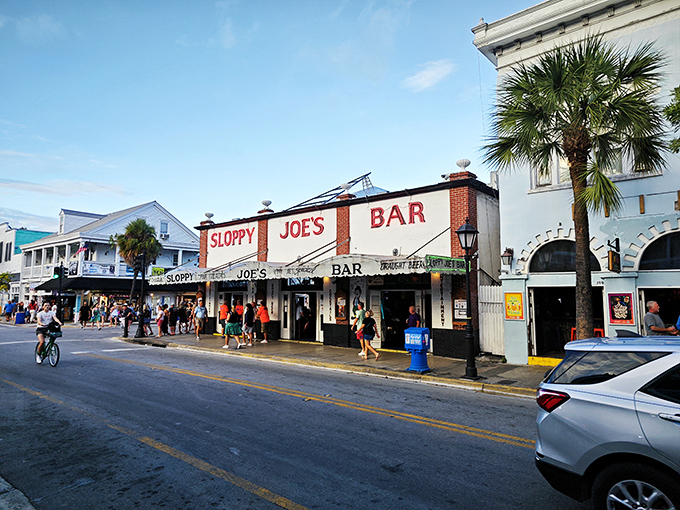 The iconic red and white fa&ccedil;ade of Sloppy Joe's stands proudly on Duval Street, beckoning visitors like a lighthouse for the thirsty sailor.