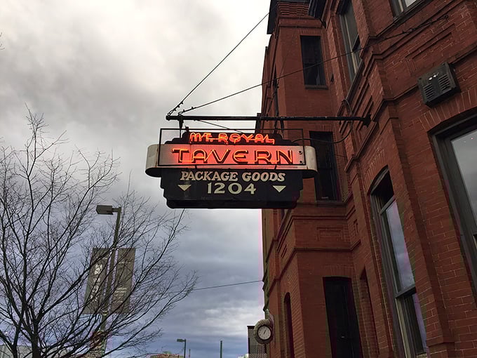 The iconic neon sign beckons like a lighthouse for thirsty souls, promising refuge and revelry at Baltimore's beloved Mt. Royal Tavern.