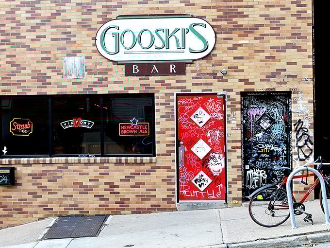 The iconic brick fa&ccedil;ade of Gooski's looks like the gatekeeper of Pittsburgh's underground music scene, complete with generations of sticker graffiti chronicling its storied history.