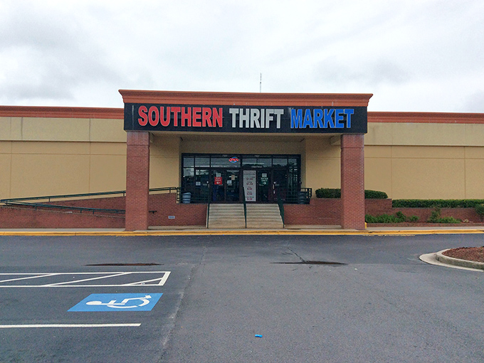 The Southern Thrift Market stands proudly against a blue Georgia sky, its colorful sign promising adventures in secondhand treasures within.