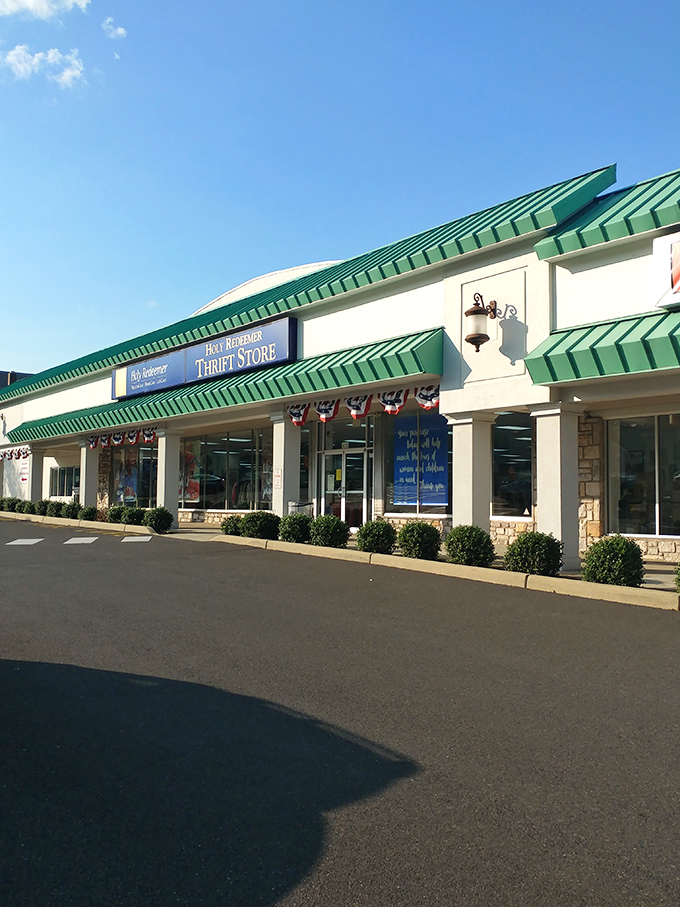 The distinctive green-trimmed exterior of Holy Redeemer Thrift Store stands like a treasure chest waiting to be opened, promising adventures in secondhand shopping.