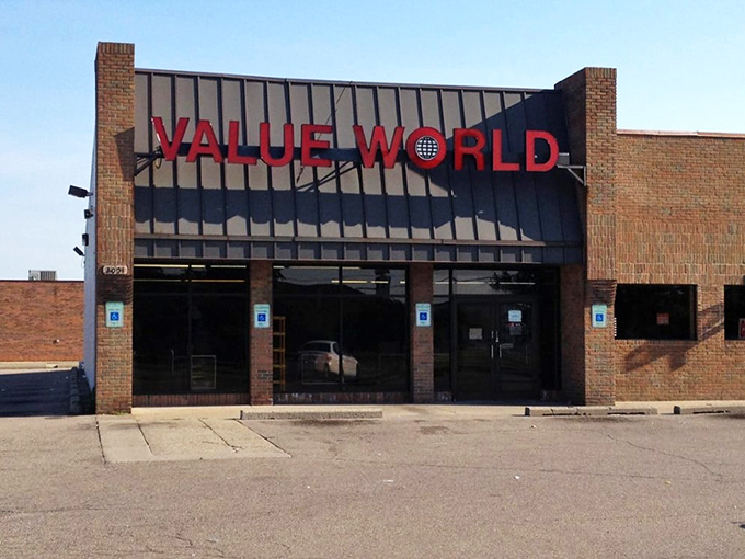 The brick facade of Value World stands proudly against a blue Michigan sky, like a fortress guarding treasures waiting to be discovered.
