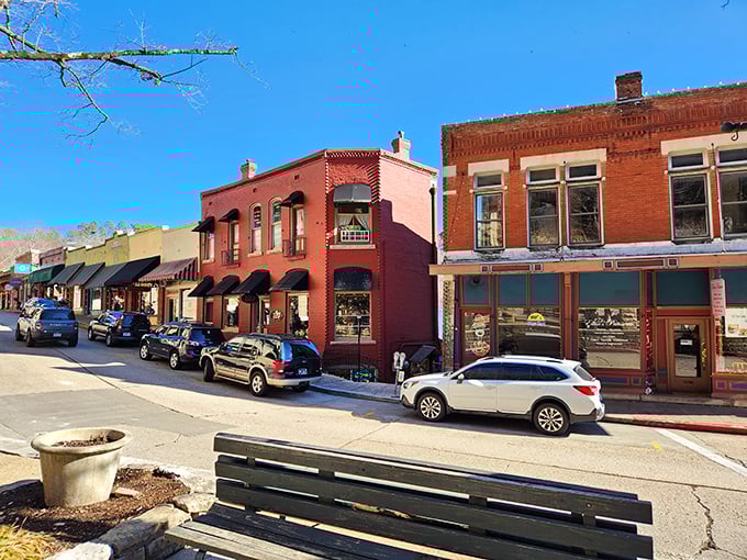 The Flatiron Building of the Ozarks stands proudly at this impossible intersection, defying gravity and common sense with Victorian flair.