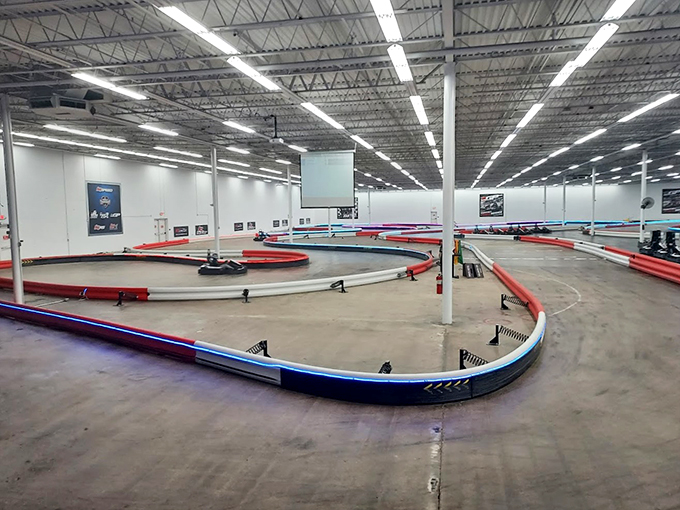 The vibrant green exterior beckons speed enthusiasts like a neon sign in the desert. Racing paradise awaits behind those unassuming walls.