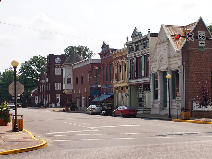 Historic brick facades line New Harmony's main street, where 19th-century architecture meets small-town charm in a perfectly preserved tableau.