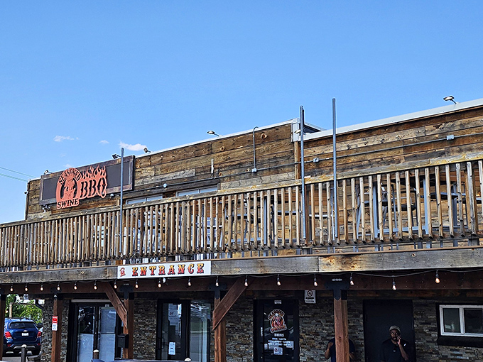 The rustic wooden exterior of Seasoned Swine BBQ beckons like a siren song to meat lovers. That deck practically begs you to enjoy your brisket with a side of Colorado sunshine.