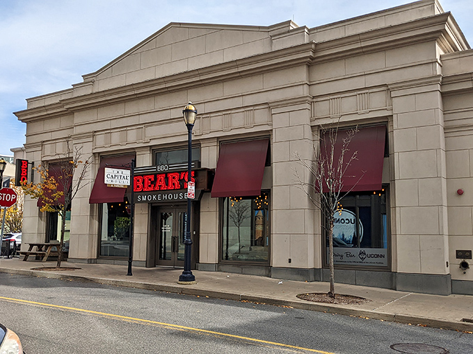 The glowing red sign of Bear's Smokehouse beckons like a barbecue lighthouse, guiding hungry souls through downtown Hartford to smoky salvation.