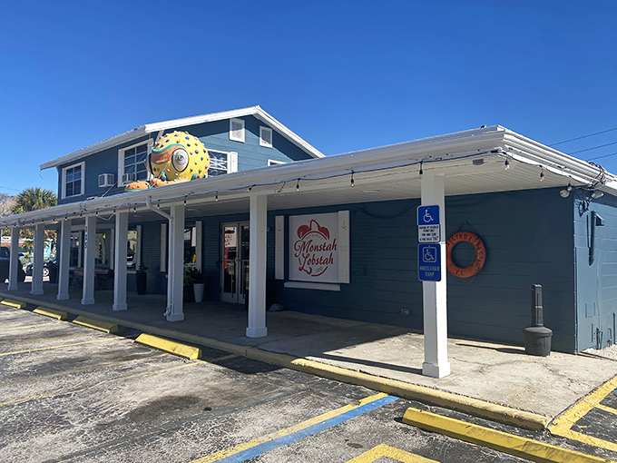 The blue exterior of Monstah Lobstah might not scream "culinary revelation," but that red sign promises a taste of New England that delivers every time.