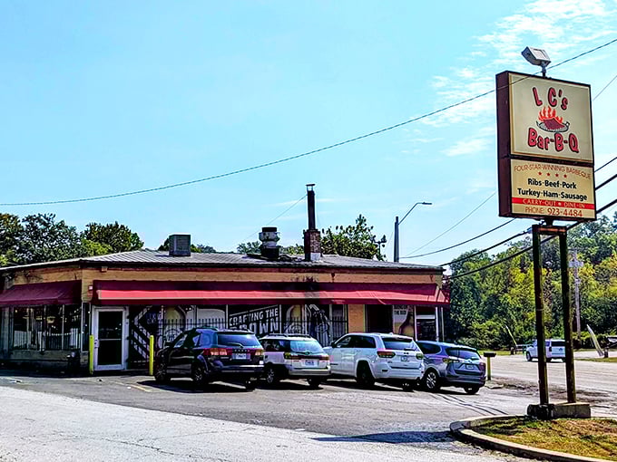 The unassuming exterior with its bright red awning houses barbecue magic that's drawn pilgrims from across Missouri for decades. 