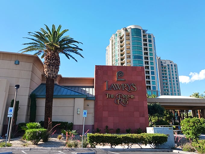 The unassuming exterior of Lawry's The Prime Rib stands like a calm oasis amid Vegas's neon storms. Palm trees welcome you to this temple of meat.