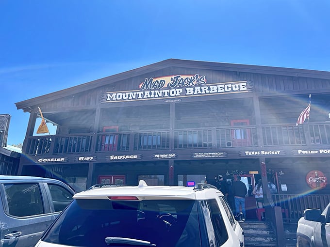 The wooden facade of Mad Jack's stands like a barbecue beacon in the mountains, promising smoky treasures within those rustic walls.