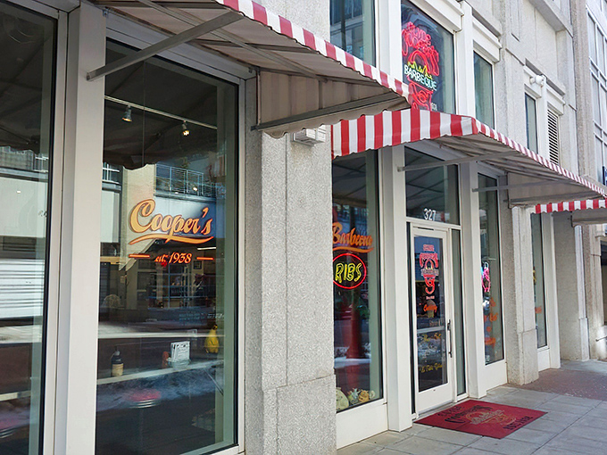 The neon glow of Clyde Cooper's storefront is like a lighthouse for hungry barbecue pilgrims, beckoning from downtown Raleigh since 1938.