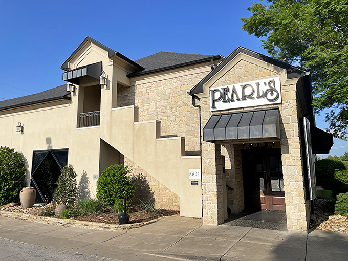 Pearl's striking stone exterior stands like a coastal mirage in Oklahoma City, complete with a rooftop patio that begs for sunset cocktails and seafood feasts.