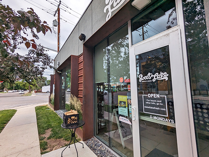 The unassuming gray exterior hides culinary treasures within, like finding a hidden jazz club that serves breakfast instead of bebop.