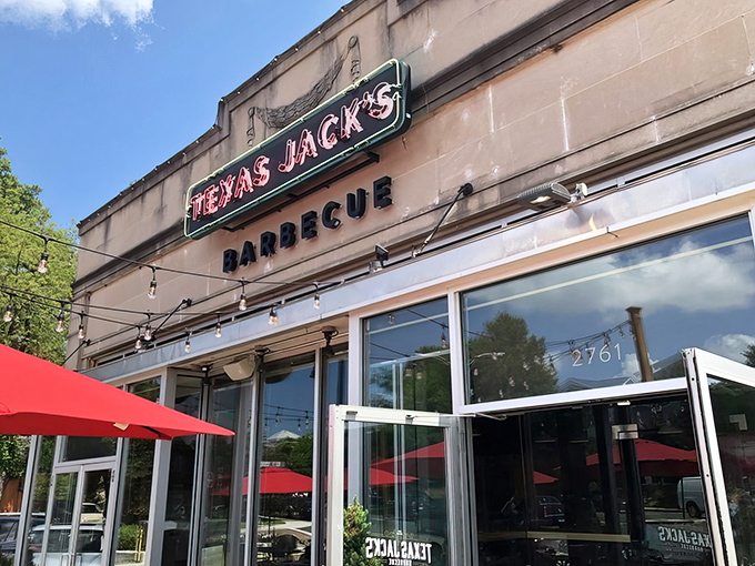 The inviting exterior of Texas Jack's Barbecue beckons with its vintage-style neon sign and string lights&mdash;like a beacon of smoky salvation on Arlington's Washington Boulevard.