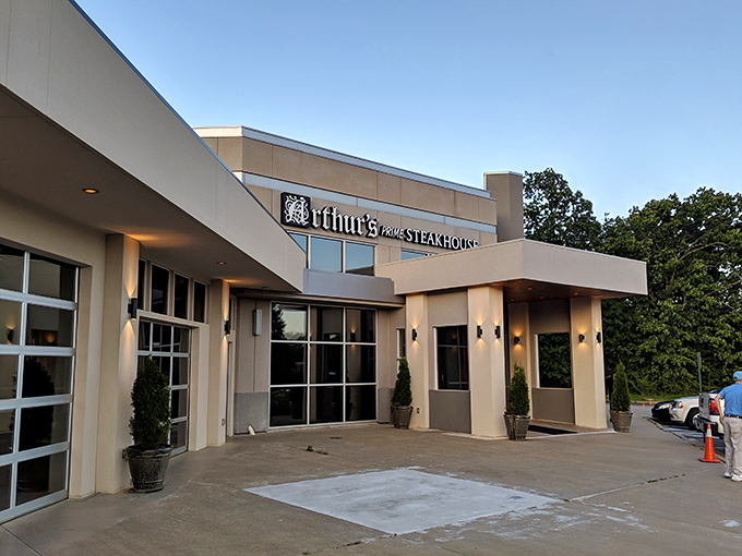 The modern fa&ccedil;ade of Arthur's Prime Steakhouse belies the old-world charm within. String lights create an inviting glow as evening approaches.