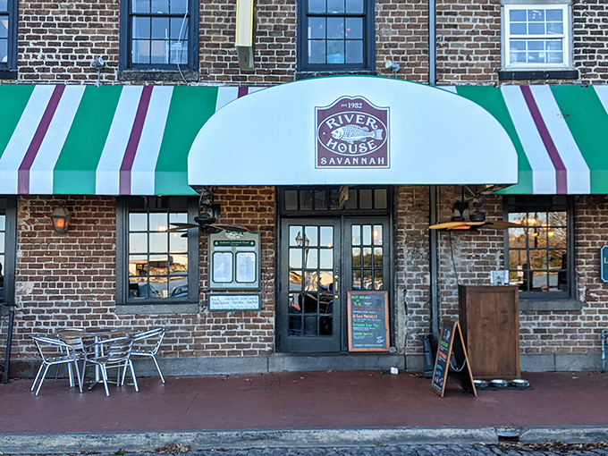 The iconic green and white striped awnings of River House welcome you to a slice of Savannah history on the cobblestone riverfront.
