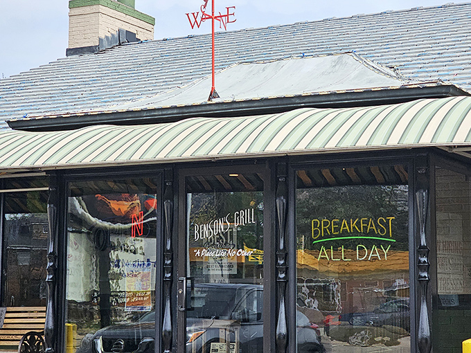 The parking sign says it all &ndash; this isn't just a meal, it's a destination worth navigating to. Benson's Grill beckons hungry travelers under clear Arkansas skies.