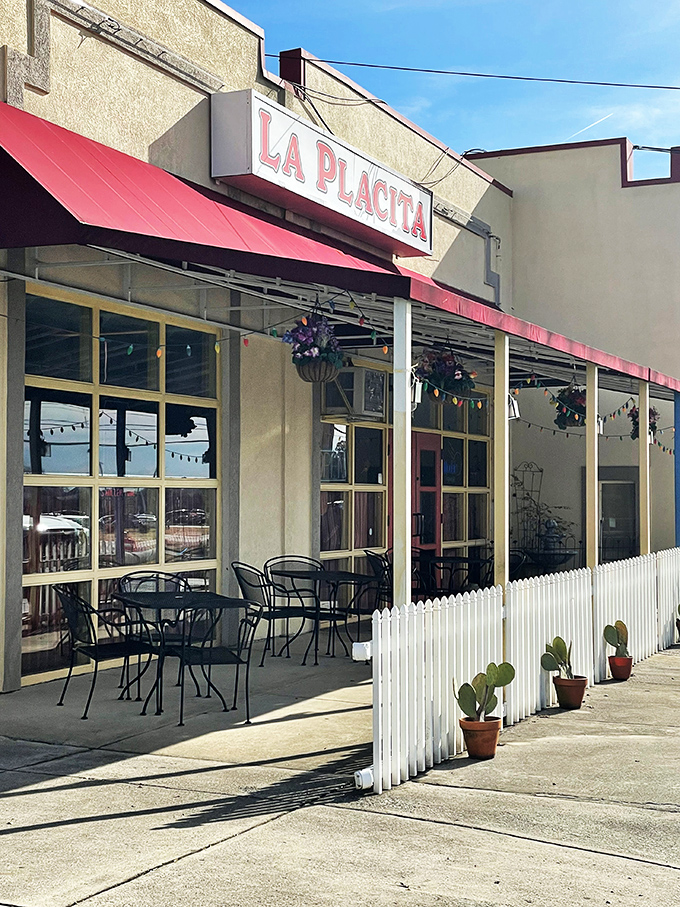 La Placita's cheerful exterior beckons with its bright yellow walls and red awning&mdash;like a sunset wrapped around a building that promises culinary adventure inside.