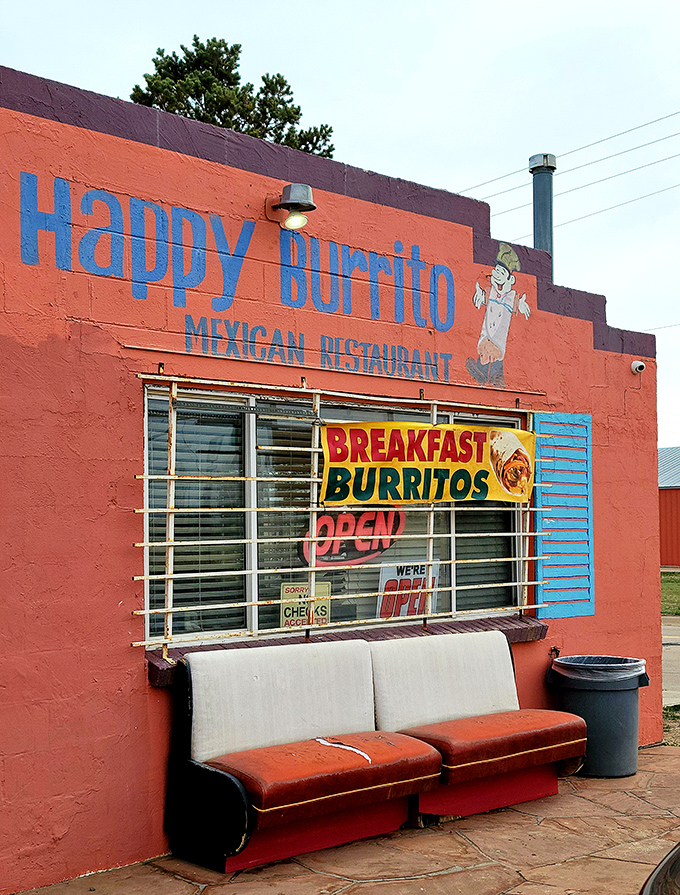The pink adobe exterior of Happy Burrito stands out like a desert mirage, complete with vintage Studebaker that's as classic as their recipes.