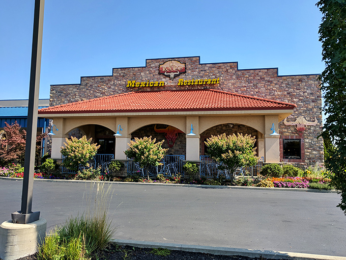 El Rodeo East's stone facade and terracotta roof stand like a delicious mirage in Richmond, promising authentic flavors behind those welcoming arches.