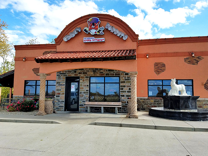 Stone archways and vibrant orange walls create the perfect backdrop for what's about to become your new favorite Mexican escape in Ohio.