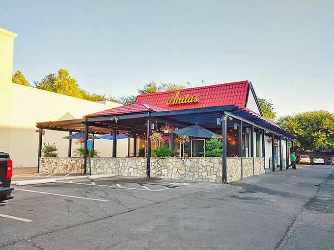 The distinctive terracotta roof and stone facade of Anita's stands like a Southwestern mirage in suburban Fairfax, beckoning hungry travelers with promises of New Mexican delights.