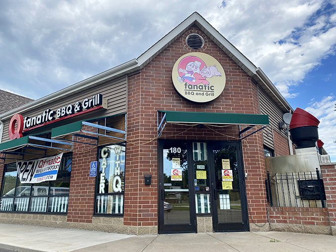 Welcome to BBQ paradise! Q Fanatic's exterior promises smoky delights, with its cheerful pig-and-cow logo acting as a meaty bat-signal for hungry patrons.