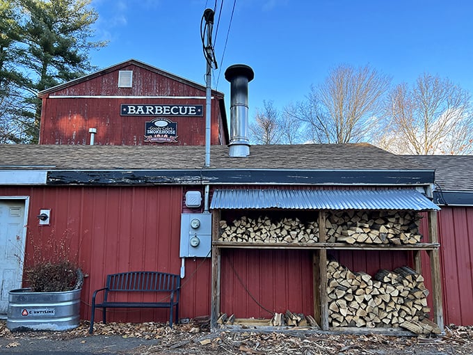 The weathered red barn exterior isn't just rustic charm&mdash;it's a smoke signal to BBQ pilgrims that authentic flavor awaits inside this New Hampshire treasure.