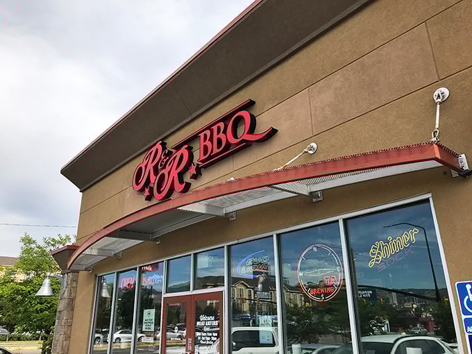 The red R&R BBQ sign beckons like a smoky siren call against the Utah sky. Simplicity on the outside belies the flavor explosion waiting within.