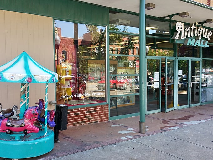 The vintage "Antique Mall" sign beckons like an old friend, promising treasures behind those glass doors on Massachusetts Street.