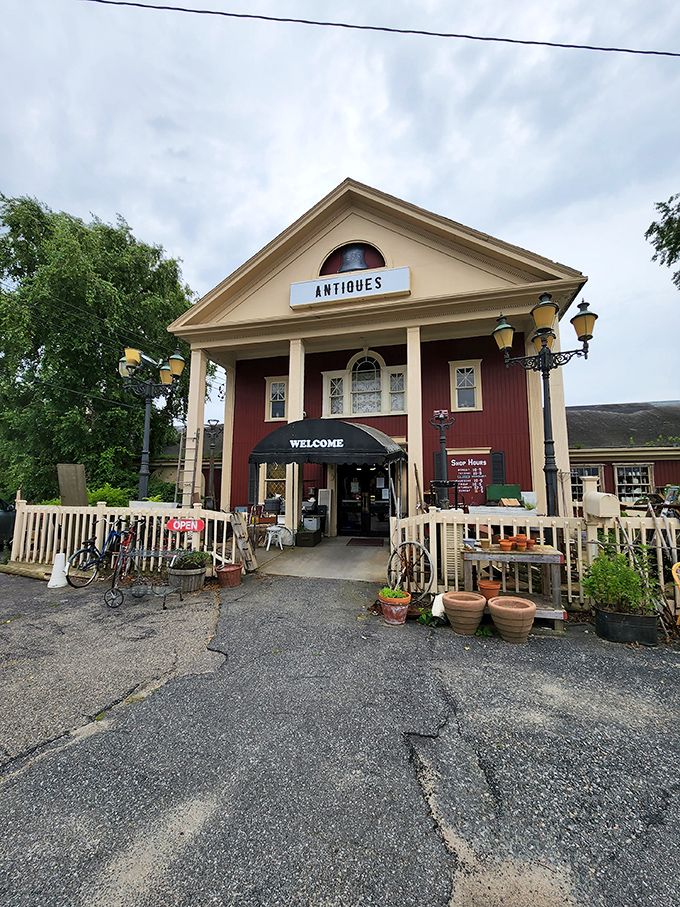 A New England time portal disguised as a charming red building with white trim. Cape Cod's architectural equivalent of "come on in, we've got stories to tell." 