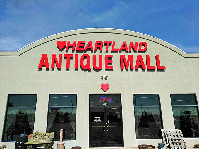 The bright red signage against a clear blue Missouri sky promises treasures within &ndash; your first clue that normal shopping rules don't apply here. 